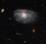Hubble spies a meandering spiral (wide field) | ESA/Hubble